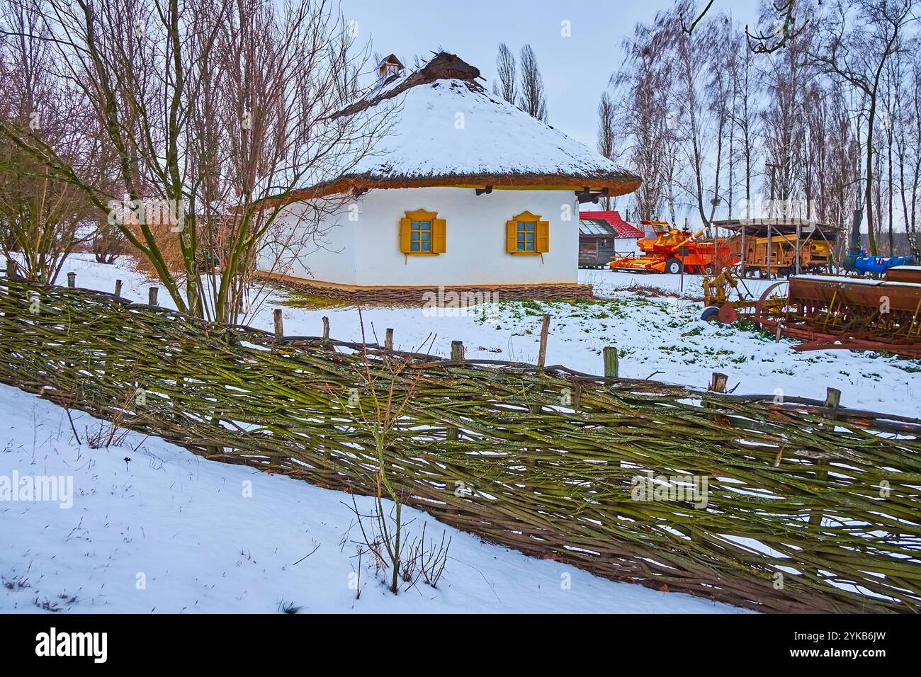 The old grain grover house behind the tyn wicker fence and the vintage ...