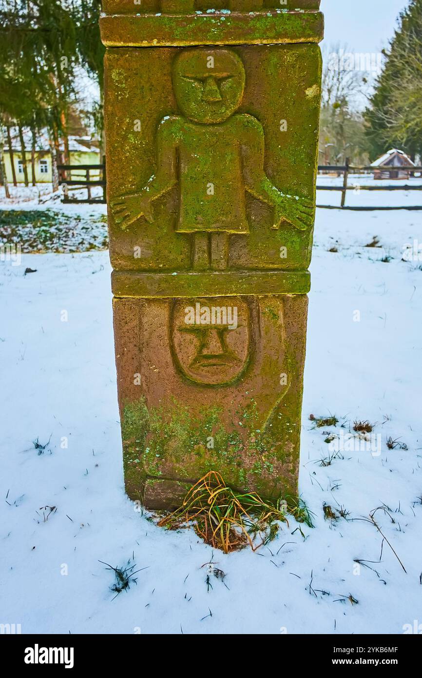 The column of the ancient Pagan Slavic idol with carved imagrs of ...