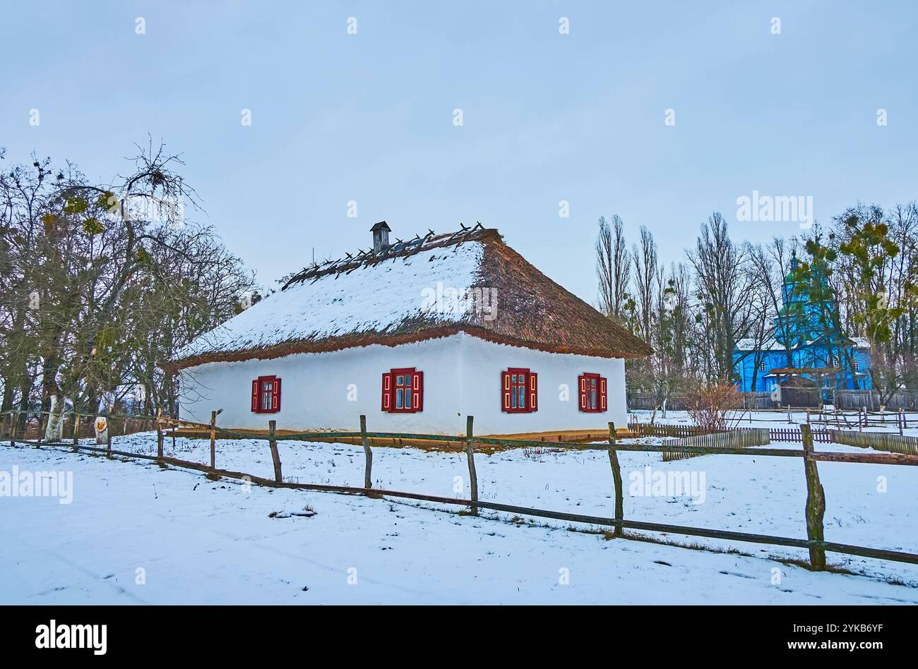 Traditional Ukrainian village hata house with thatched roof and ...