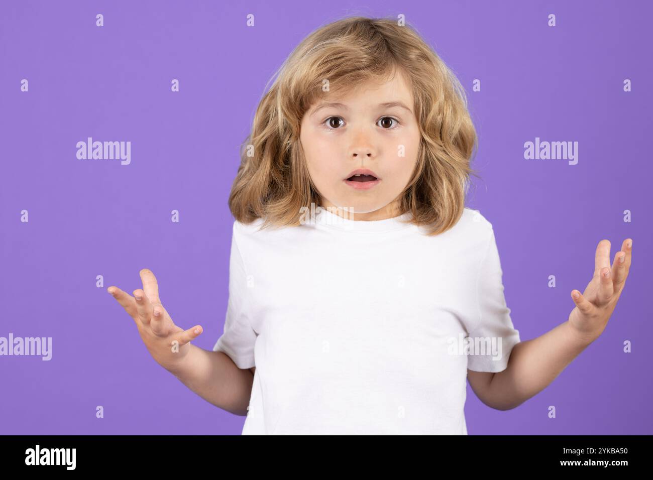 Shocked kid boy on studio isolated background. Surprised face, excited ...