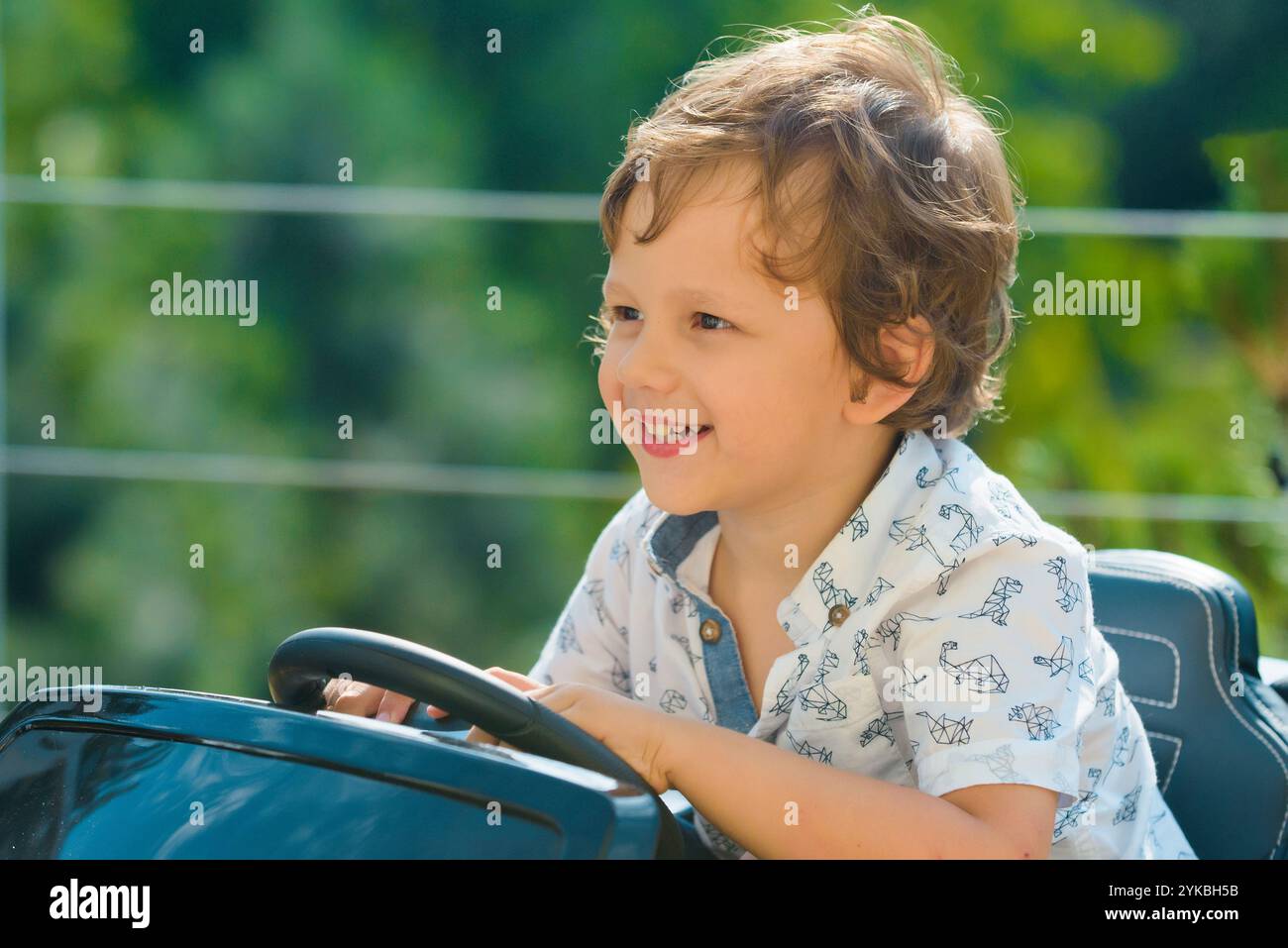 Kid Driver. Cute little baby boy pretending to drive. Kid in car with ...