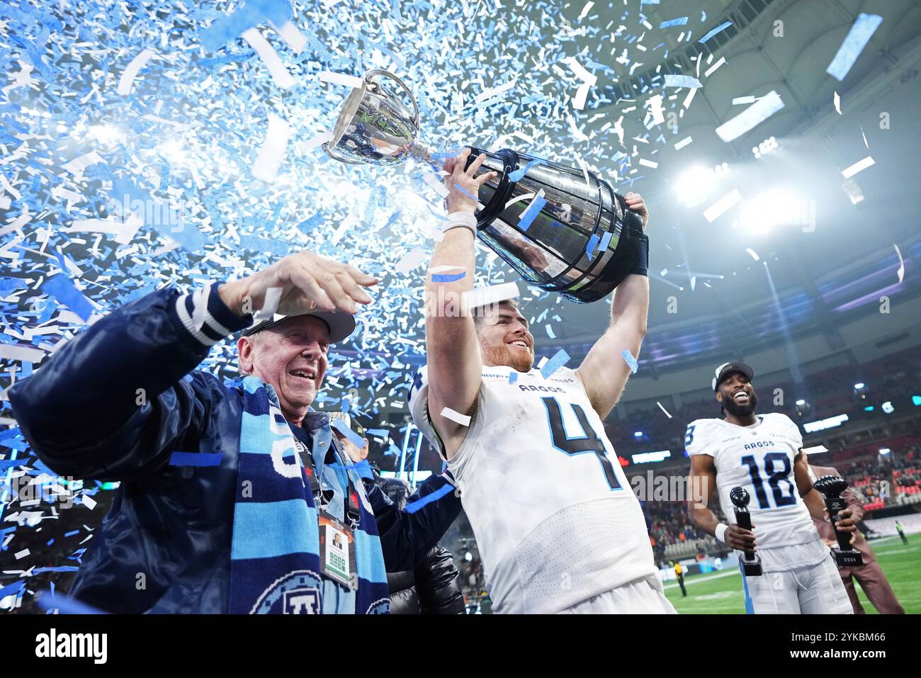 Toronto Argonauts quarterback Nick Arbuckle (4) lifts the Grey Cup ...
