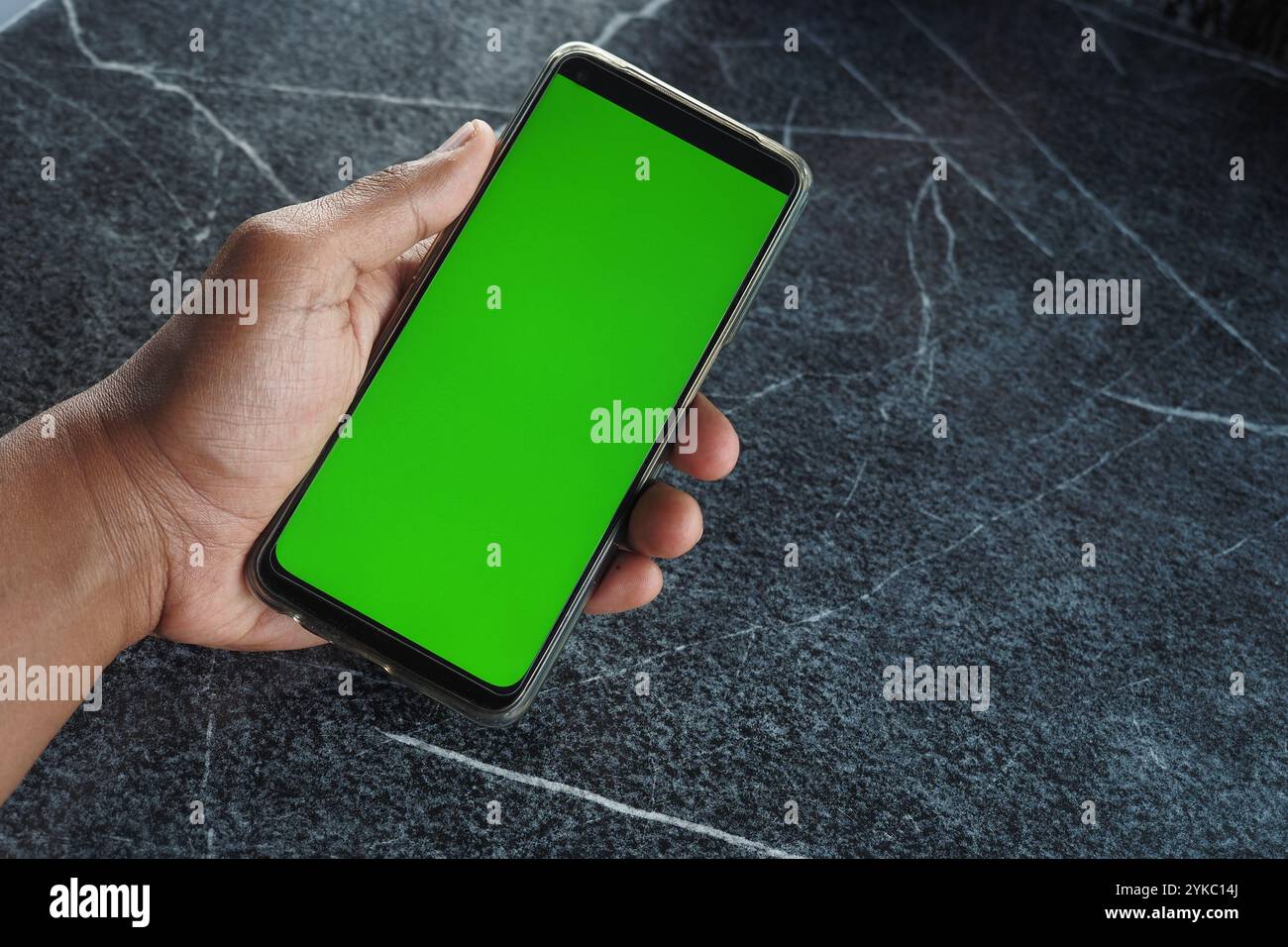 A modern smartphone with a vibrant green screen, perfect for app ...