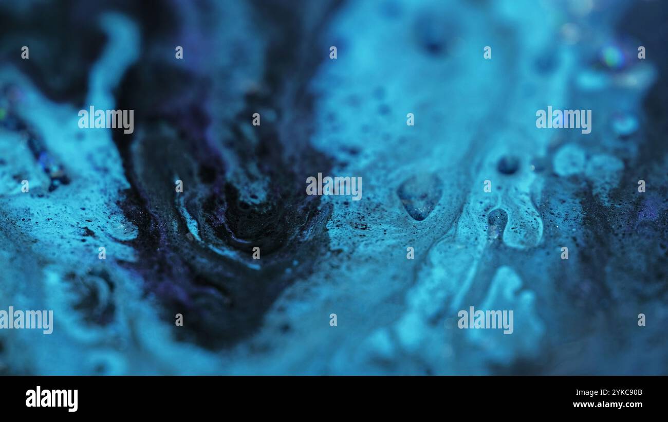 Acrylic paint. Liquid glitter drip. Defocused blue black color ...