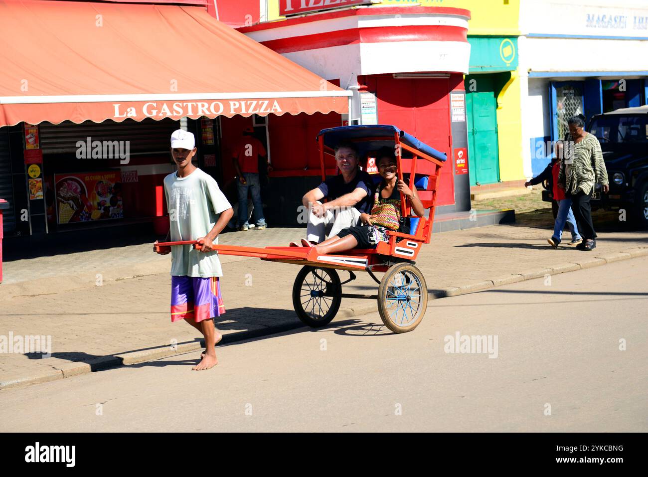 A pousse pousse in the streets of Antsirabe, Madagascar Stock Photo - Alamy
