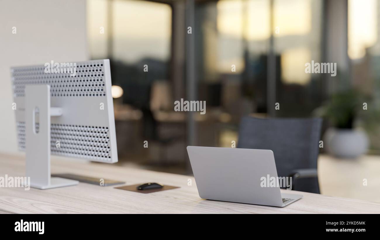 A back view of an office desk in a modern office building features a ...