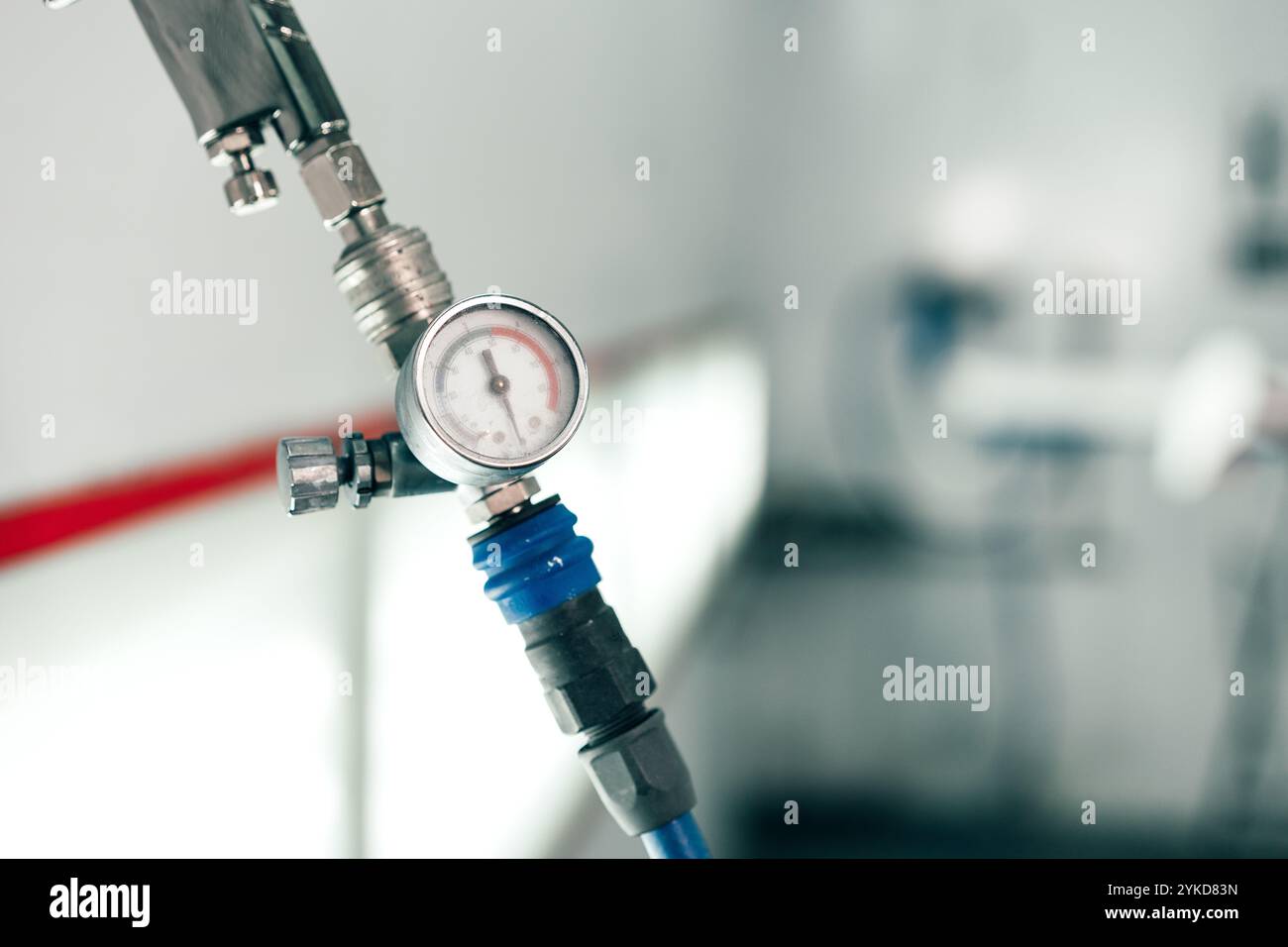 Close-up of a pressure gauge and valve in a medical facility showing ...