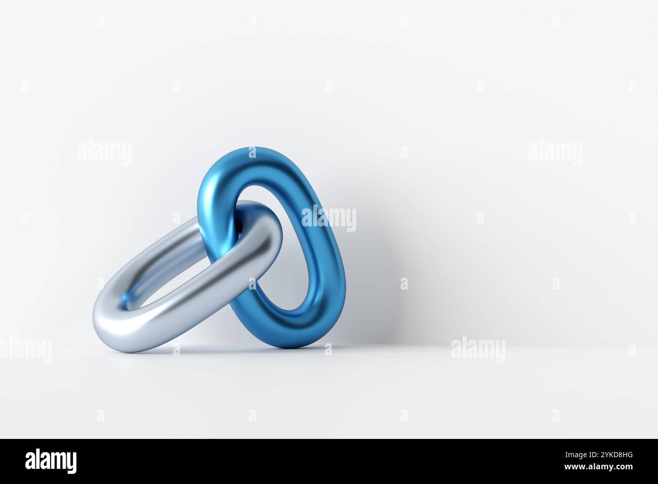 Two metal chain links, one silver and one blue, intertwined on a white ...