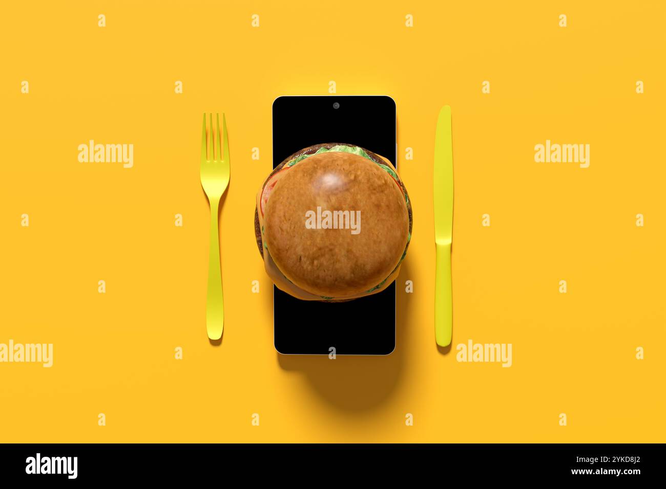 Hamburger lying on a smartphone screen with plastic fork and knife on ...