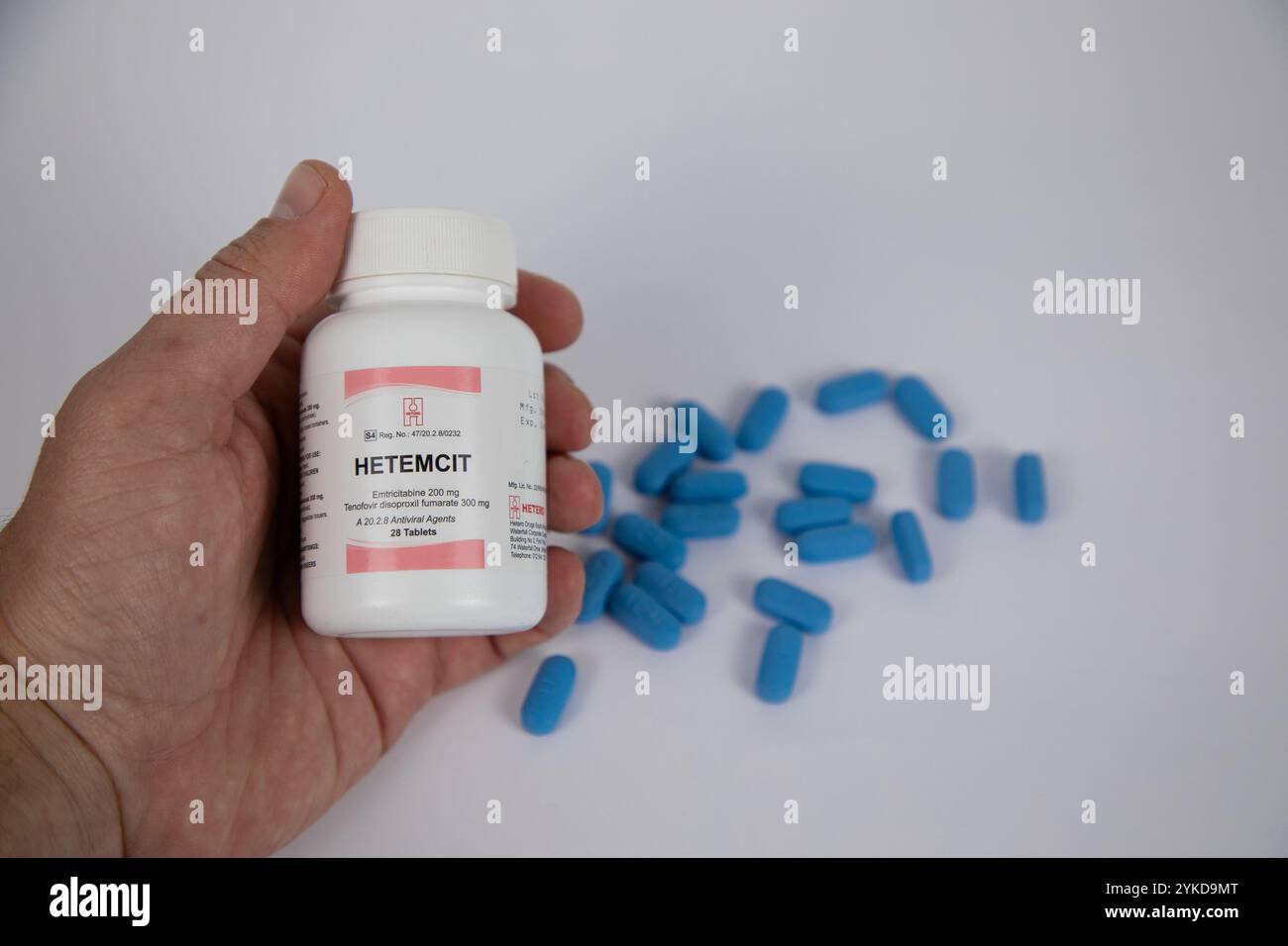 Bottle of Hetemcit pre-exposure prophylaxis pills in a caucasian hand ...
