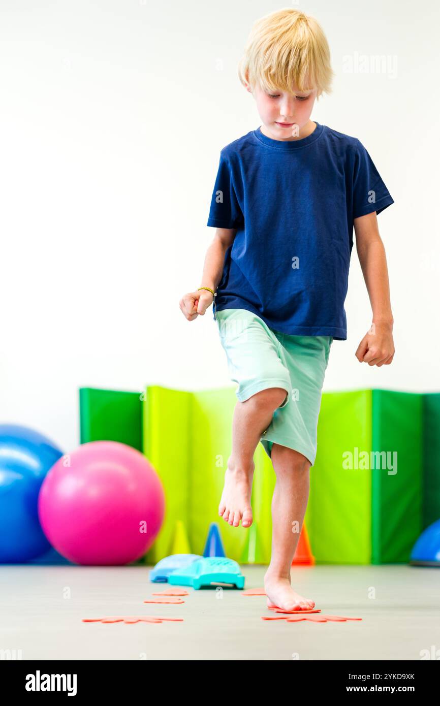 Kids physical therapy. Child exercising during session. Bilateral ...