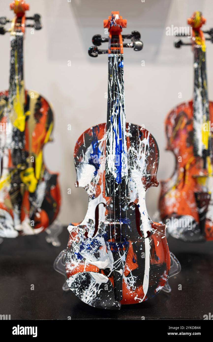 Hand-Painted Colorful Violins in a Modern Art Installation Stock Photo ...