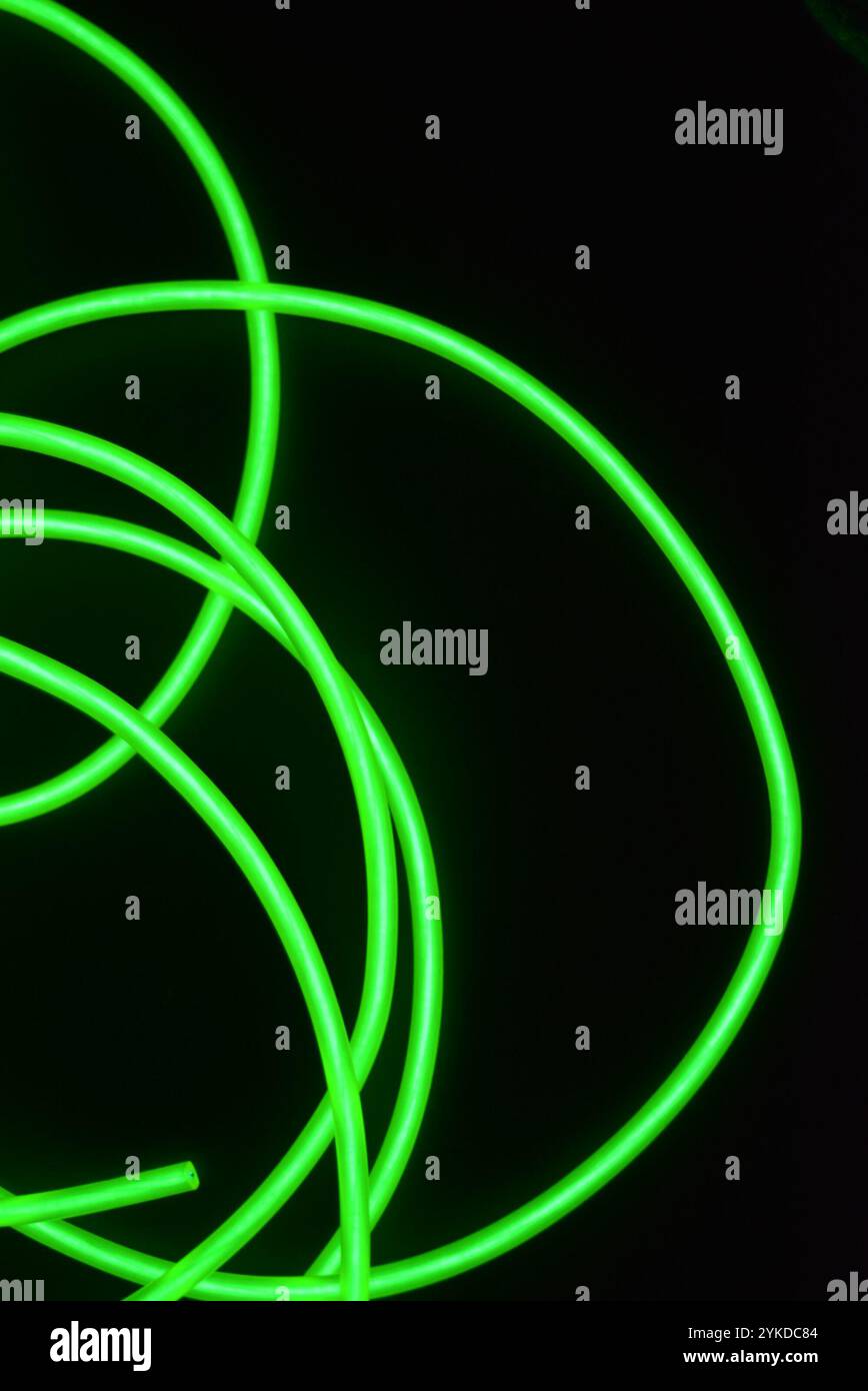 Bright glowing electroluminescent wires, light green, lime, green ...