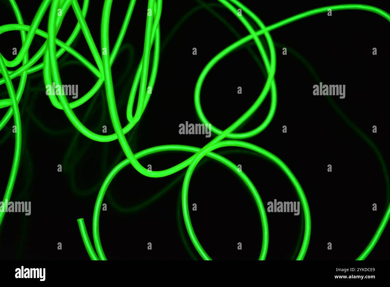 Bright glowing electroluminescent wires, light green, lime, green ...