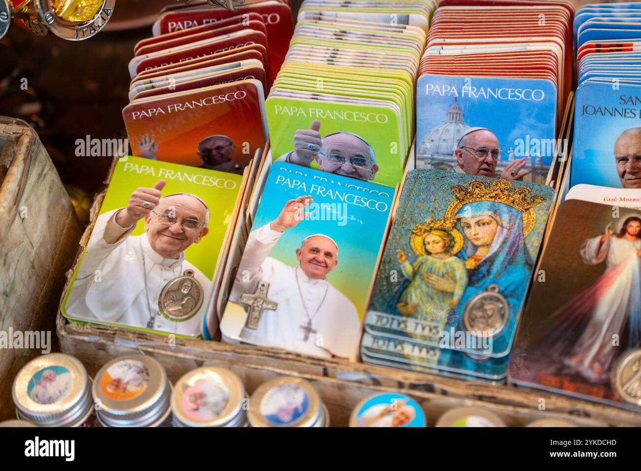 ROME, ITALY - NOVEMBER 18, 2024: Religious souvenirs and prayer cards ...
