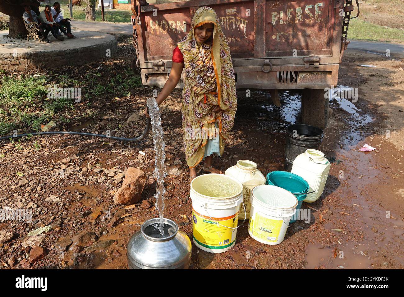 Woman collecting water in Mandu, Madhya Pradesh, India Stock Photo - Alamy