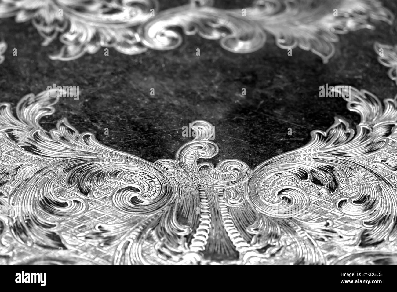 Engraving pattern background on an antique silver plate pewter tray ...