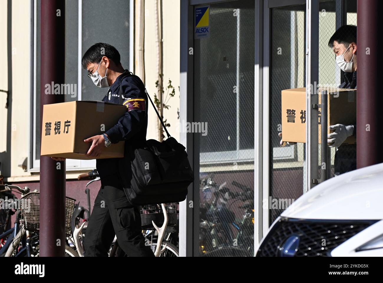 Tokyo Metropolitan Police Department investigators search for a dealer ...