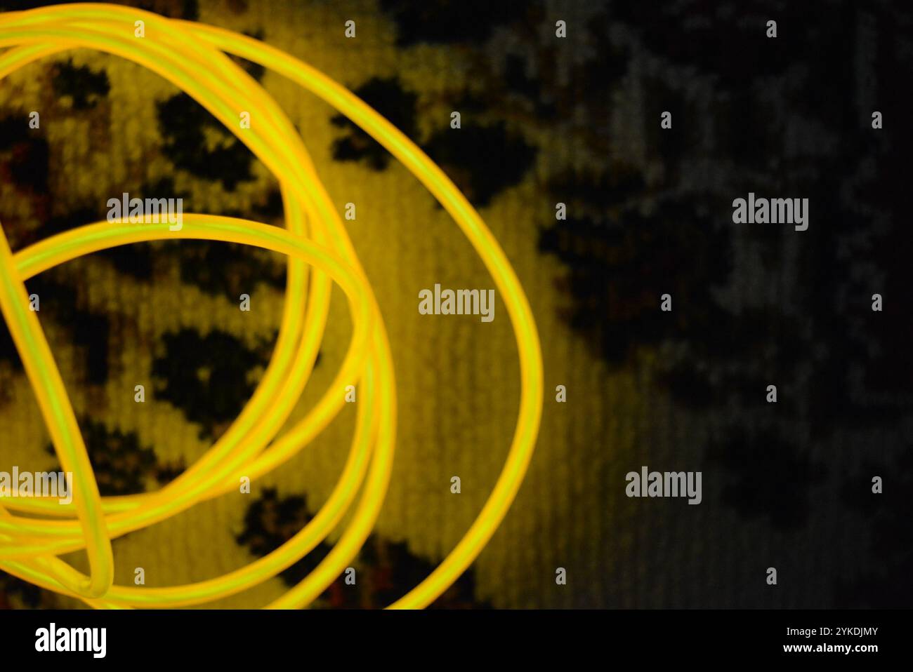 Bright glowing electroluminescent wires, yellow, orange thick light ...