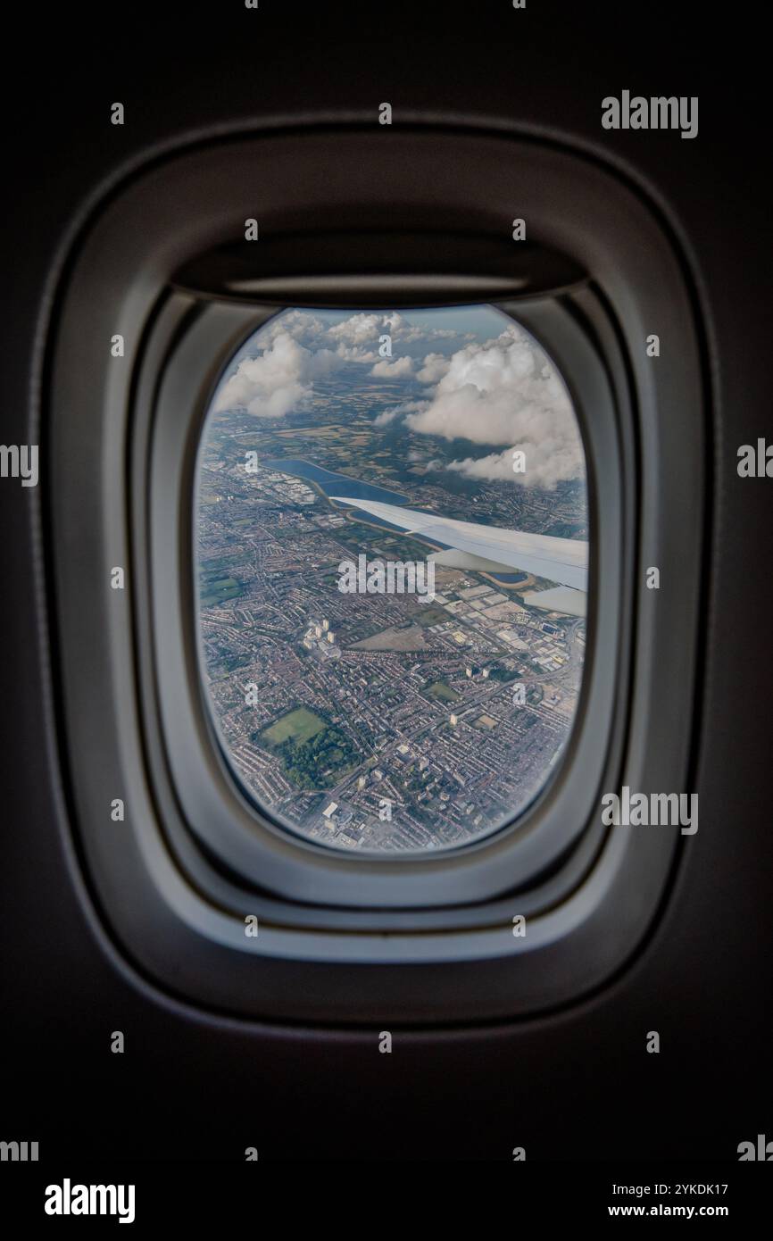 Aerial high-angle view from an airplane, show the sprawling suburbs of ...