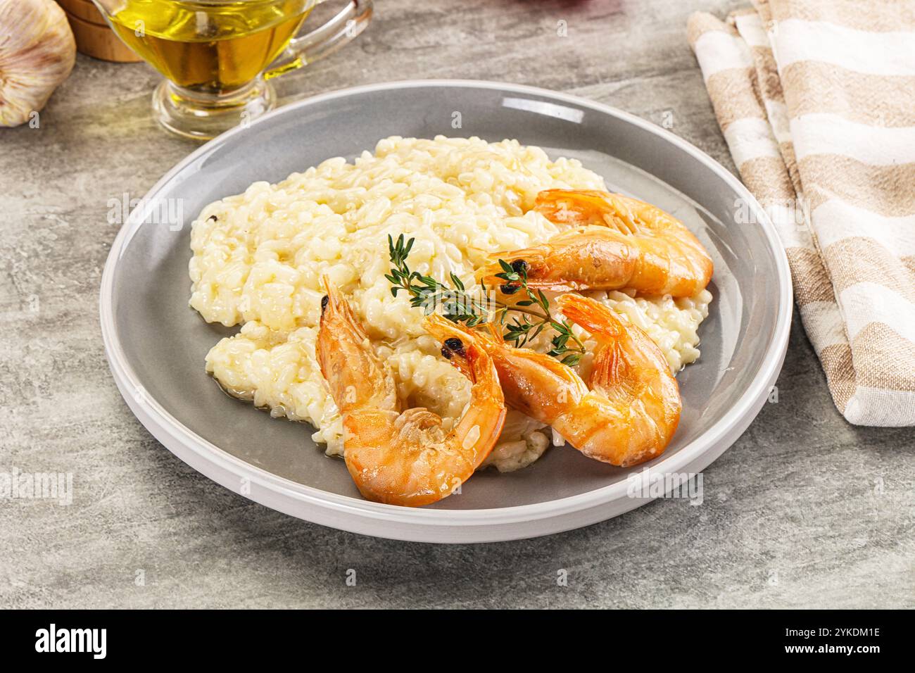 Italian cuisine - risotto with prawn served thyme Stock Photo - Alamy