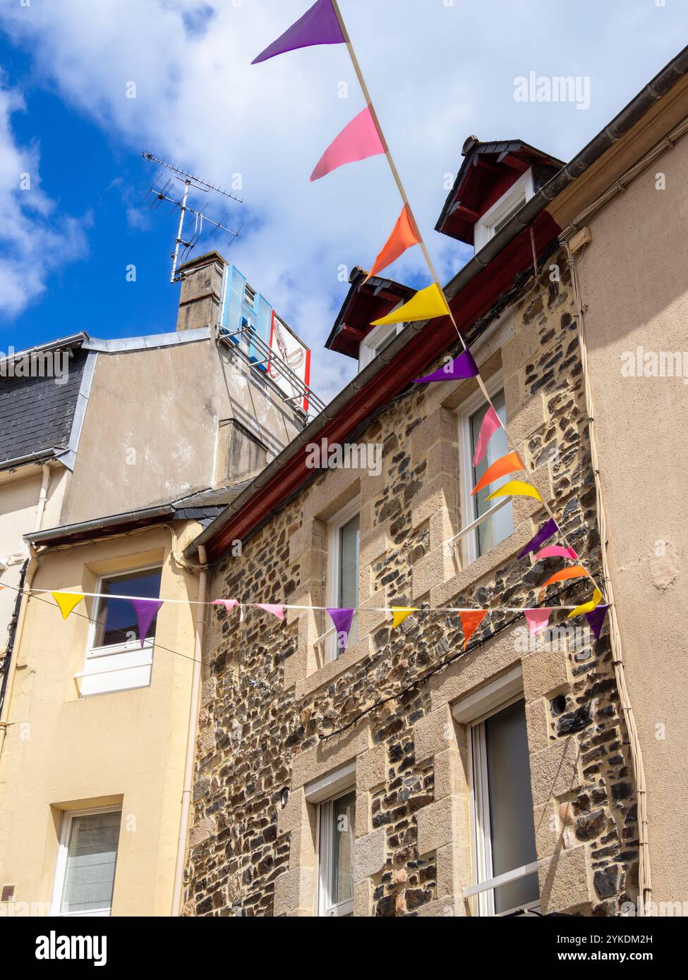 Street scene featuring colorful flags decorations. The buildings are ...