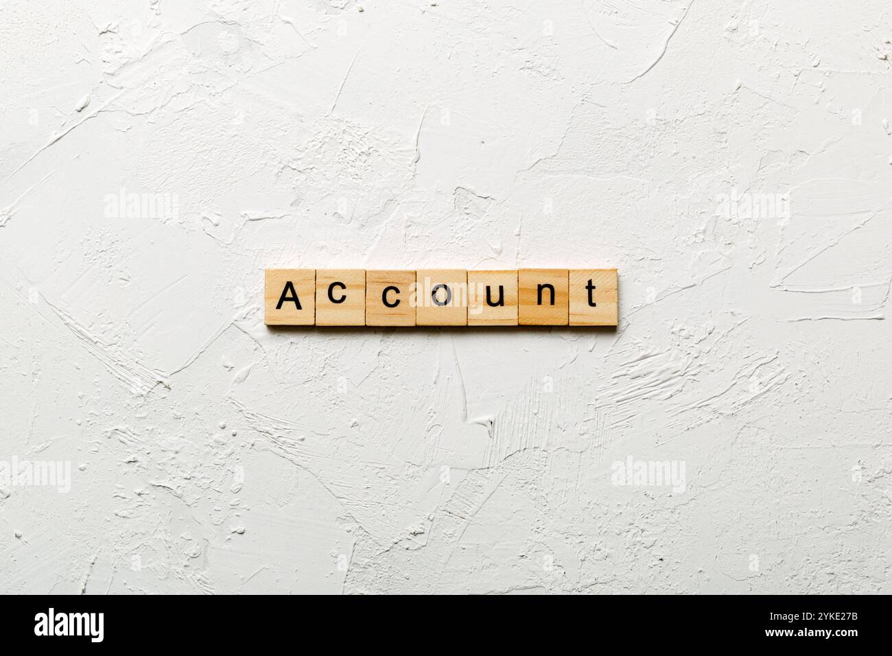 Account word written on wood block. Account text on cement table for ...