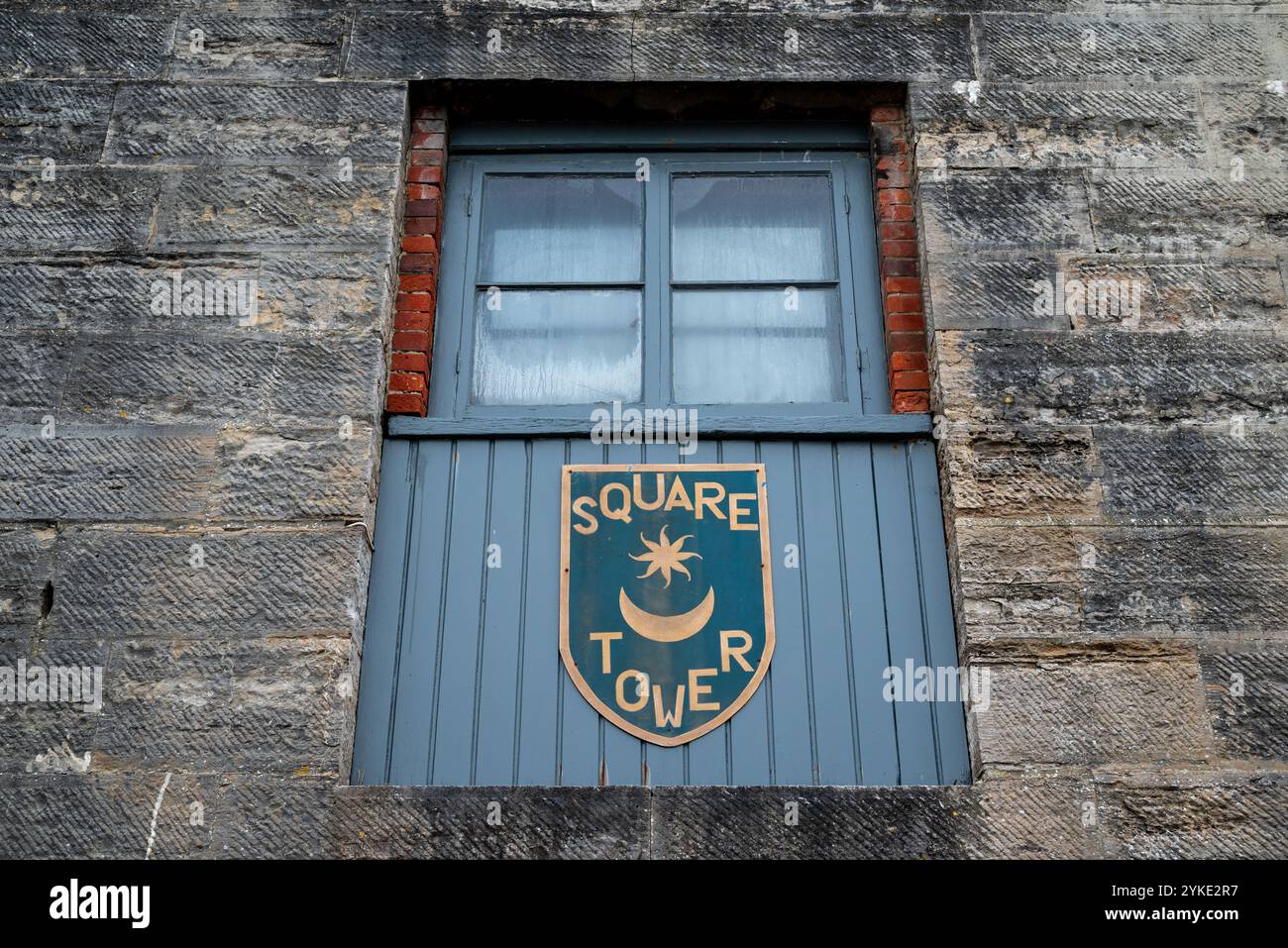 Wooden window frame with name and city emblem on the square tower in ...