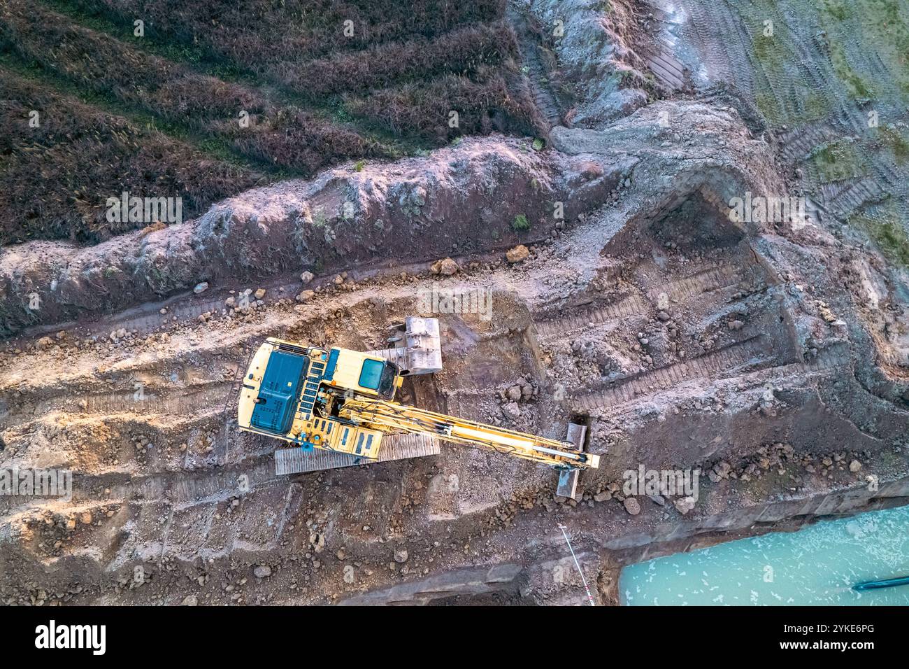 drone top view, aerial image of an earth excavator digging a trench at ...