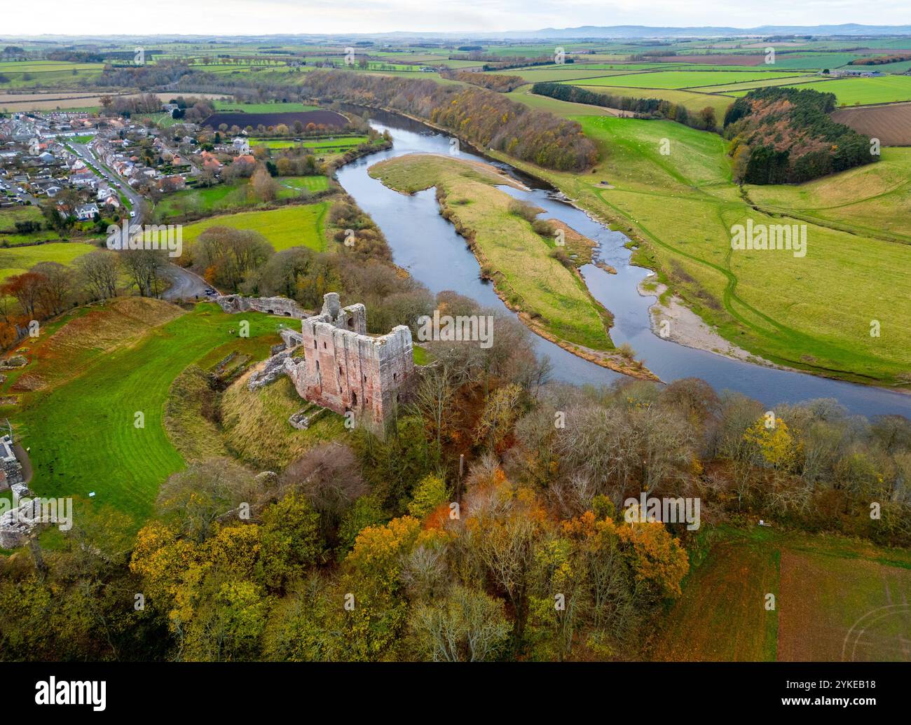 Aerial view of village of Norham and Norham Castle beside River Tweed ...