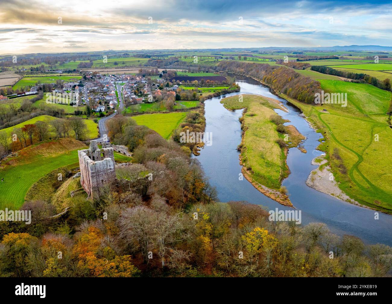 Aerial view of village of Norham and Norham Castle beside River Tweed ...