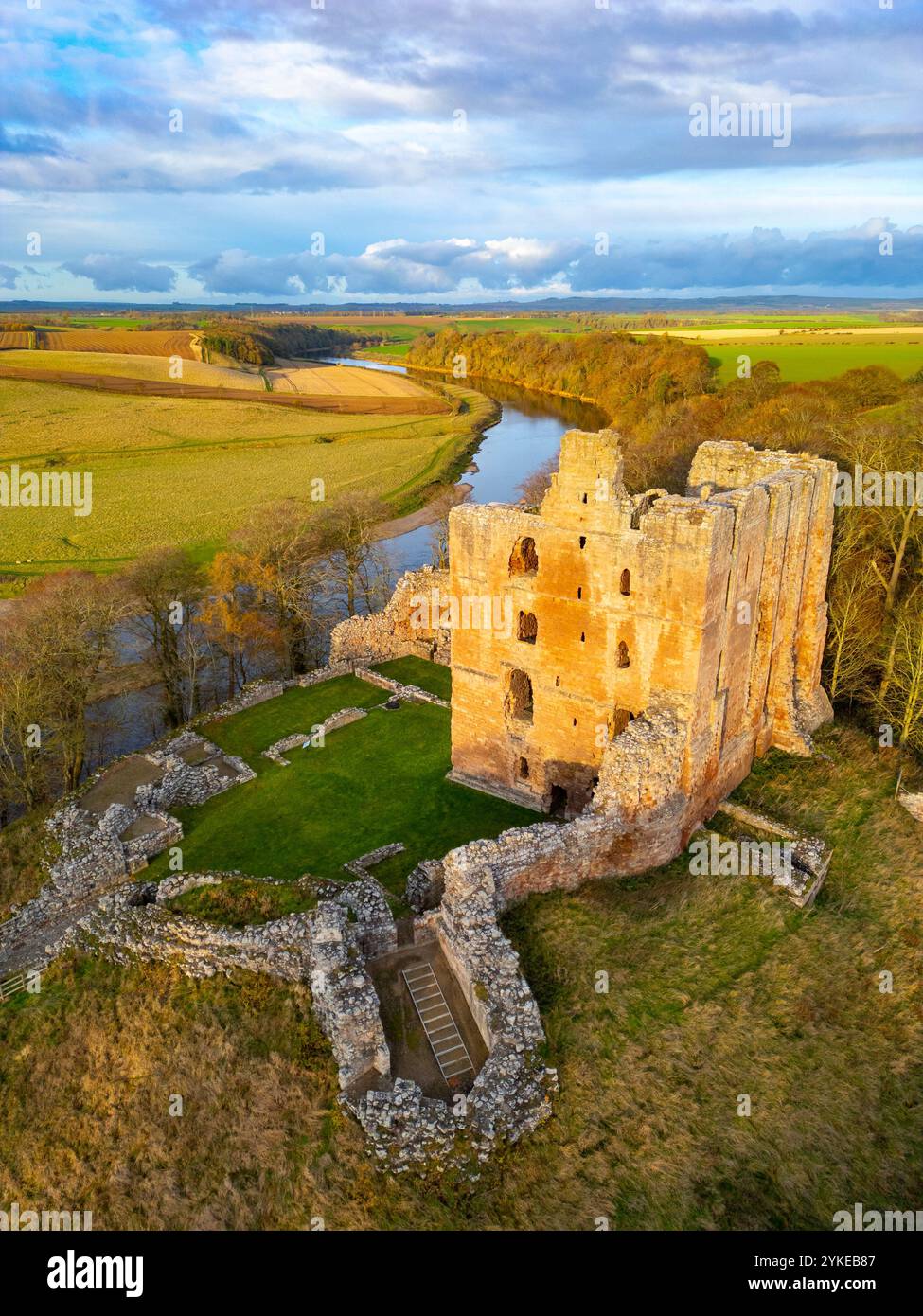 Aerial view of Norham Castle beside River Tweed on Ango-Scottish border ...