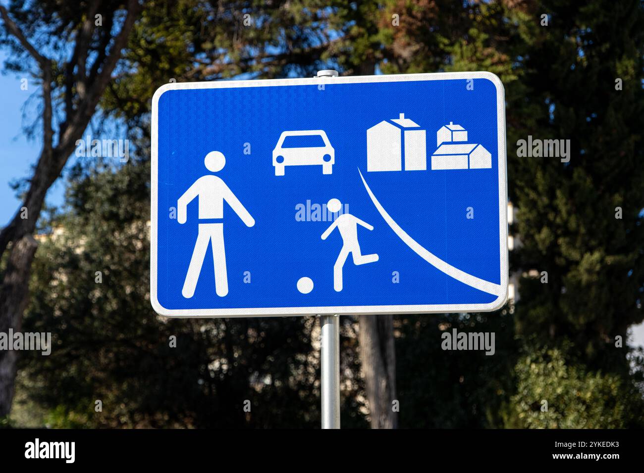 Blue residential area road sign indicating pedestrian, playing child ...