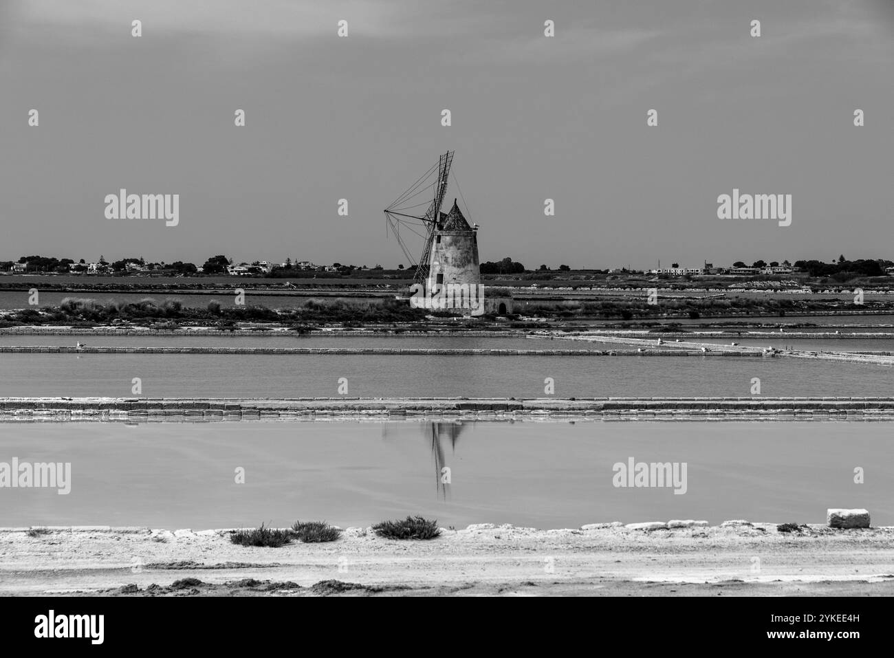 the Saline di Marsala in the Stagnone lagoon with old windmills and ...