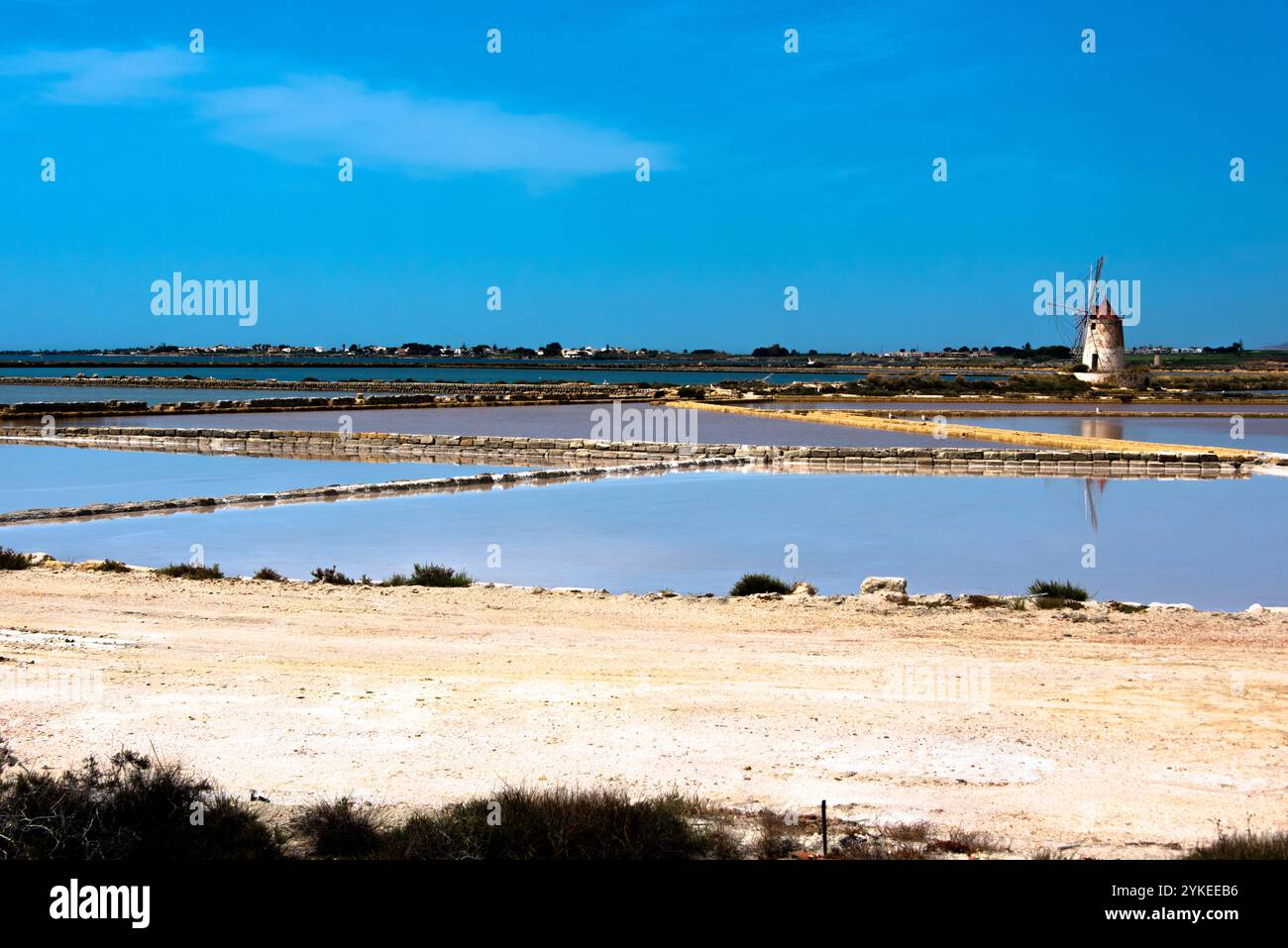 the Saline di Marsala in the Stagnone lagoon with old windmills and ...