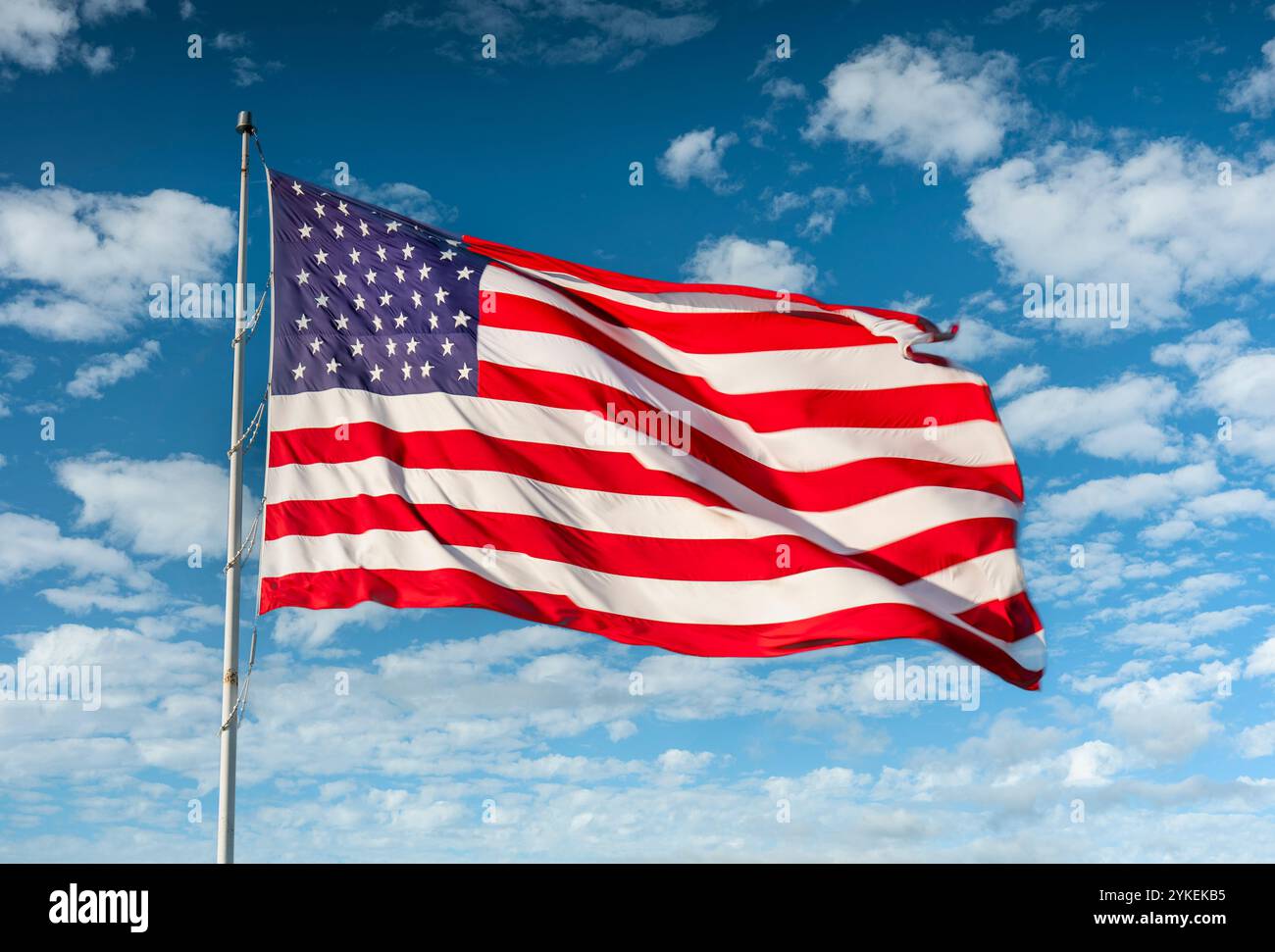 American flag blowing in the wind Stock Photo - Alamy