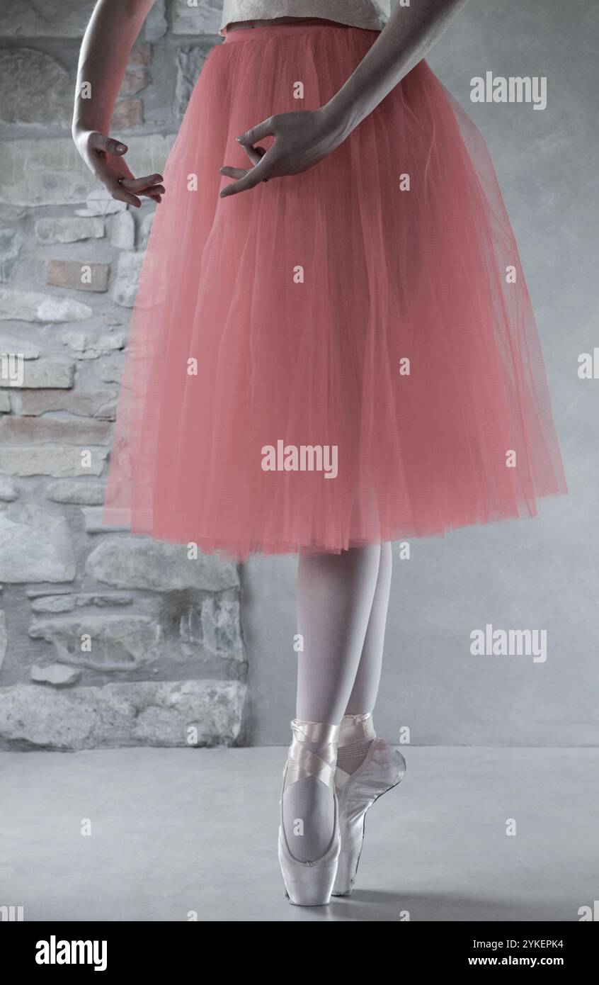 legs of ballerina with pointe shoes in fifth position Stock Photo - Alamy