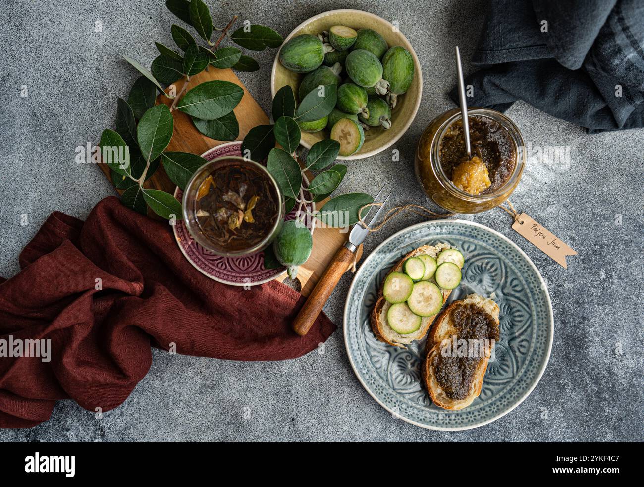 A cozy setup featuring floral tea paired with sandwiches smeared with ...
