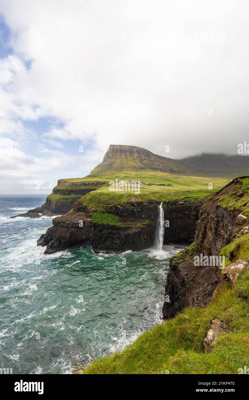 Famous Mulafossur waterfall in Gasadalur village, Vagar Island in the ...
