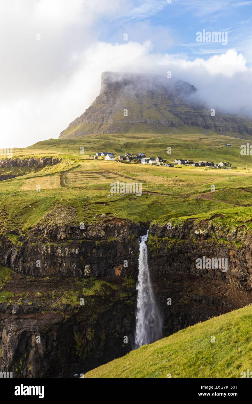 Famous Mulafossur waterfall in Gasadalur village, Vagar Island in the ...
