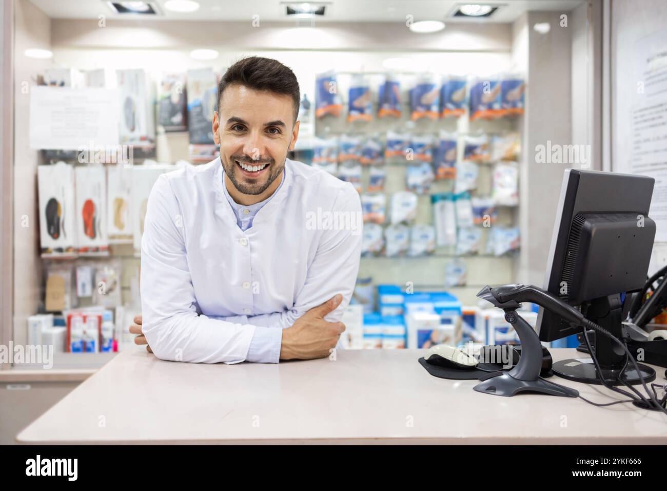 A friendly orthopedics specialist in a white coat stands behind the ...