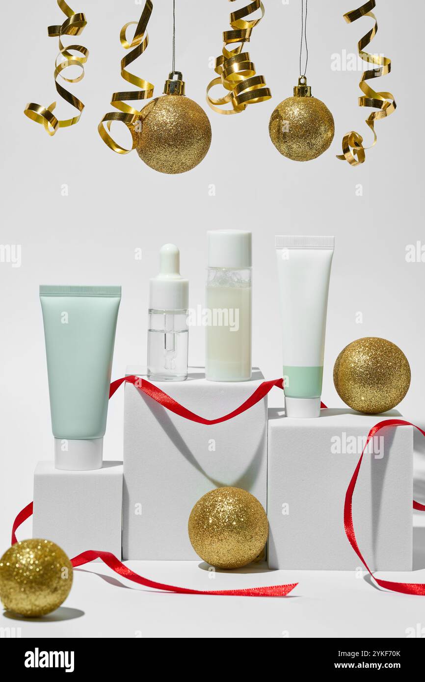 A stylish arrangement of Christmas themed cosmetics products, featuring ...
