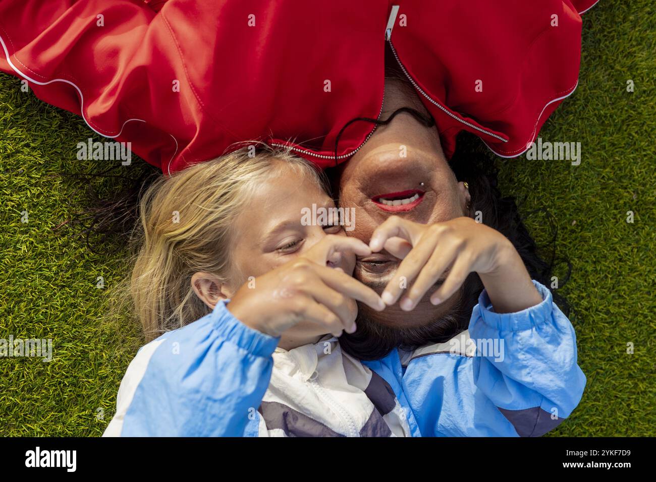 Tender moment between a mother and her blonde daughter with Stuve ...