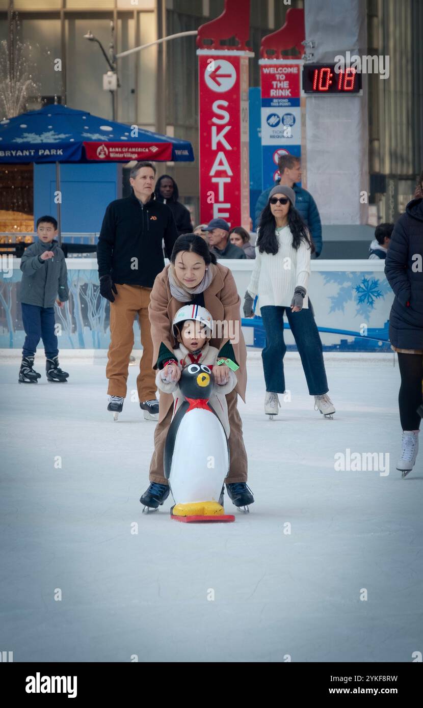 Mother & child ice skaters at the 2024 Bryant Park Winter Village rink ...