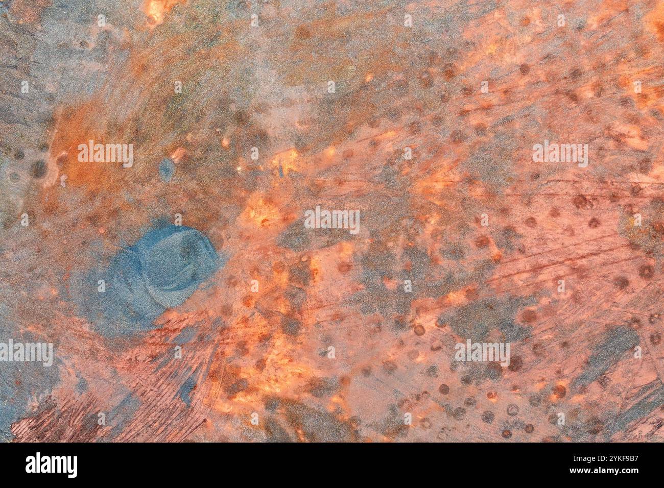 This image captures the vibrant, abstract patterns of mineral deposits ...