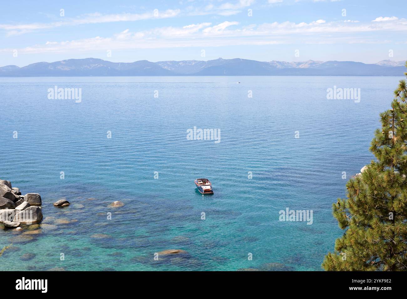 An expansive view of Lake Tahoe's clear waters stretching towards ...
