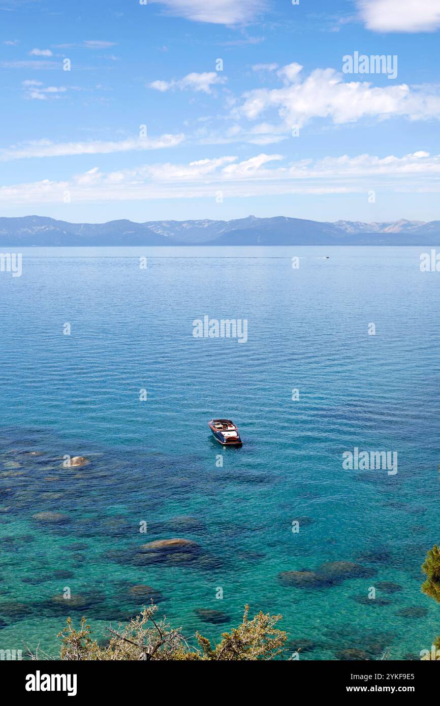 A view of a boat on the clear turquoise waters of Lake Tahoe The ...