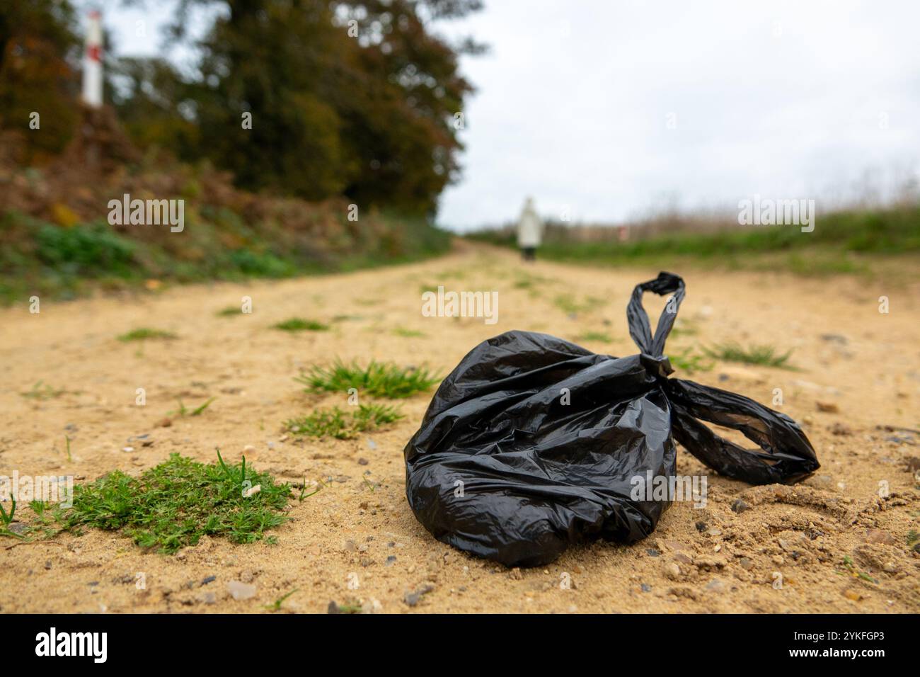 Dog Poo Bag on path Stock Photo - Alamy