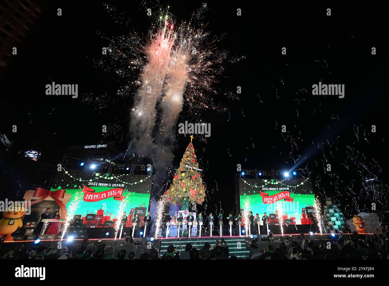 Fireworks explode in the sky during a lighting ceremony of a Christmas ...