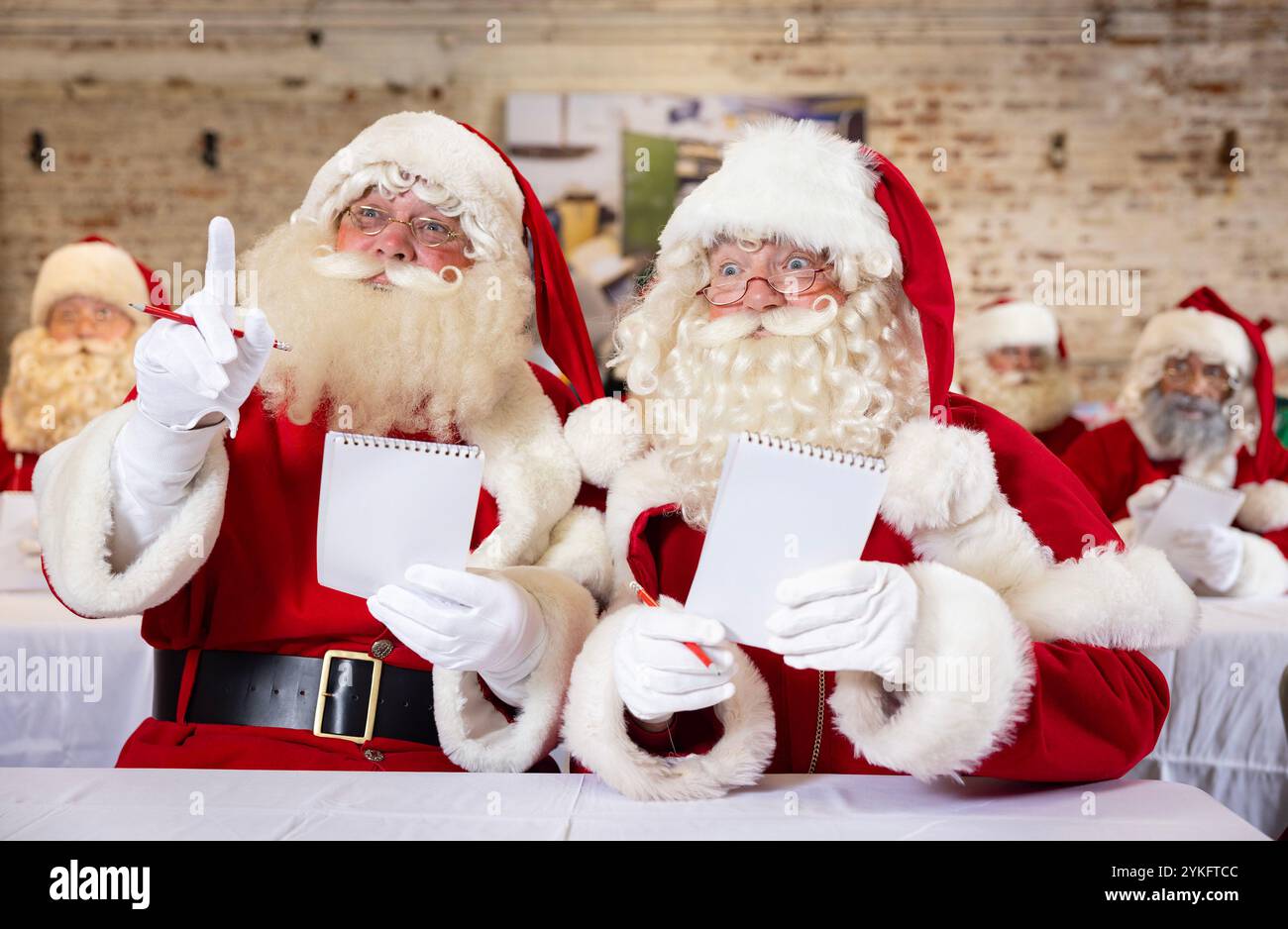 EDITORIAL USE ONLY Men dressed as Father Christmas performers take part ...